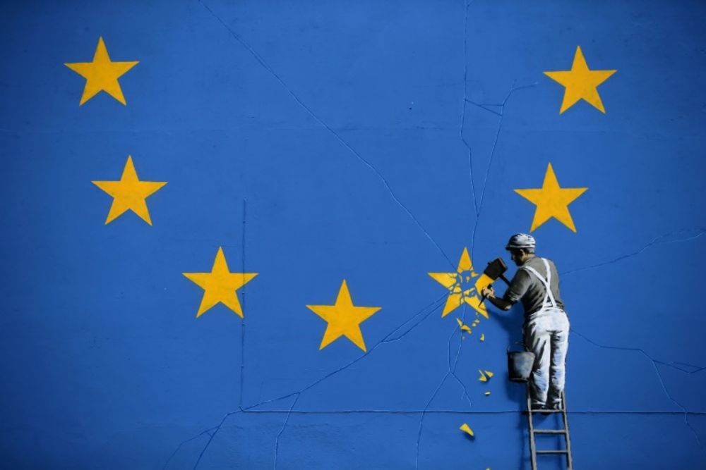 Banksy Chips Away At EU Flag In First Brexit Mural - i24NEWS